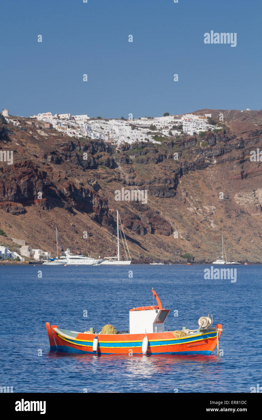 Small boat at sea. Santorini is an island in the southern Aegean Sea ...