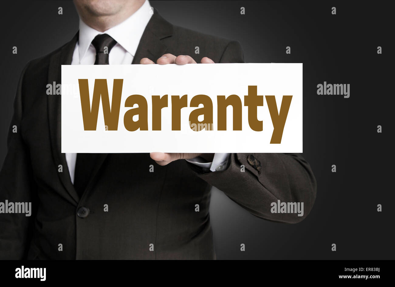 Warranty sign is held by businessman Stock Photo - Alamy