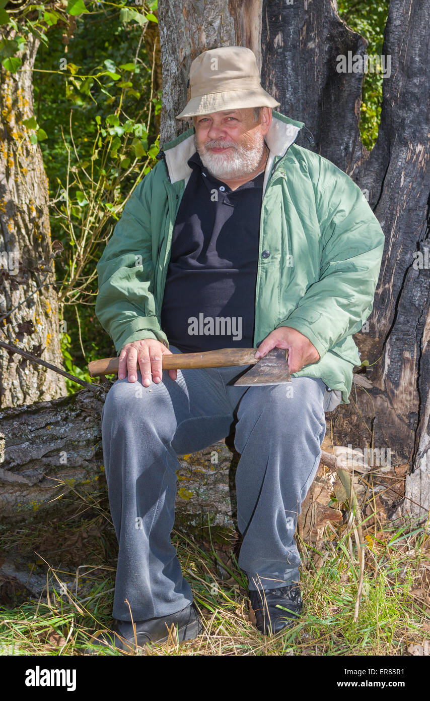 Portrait of senior lumberman having rest after hard work Stock Photo ...