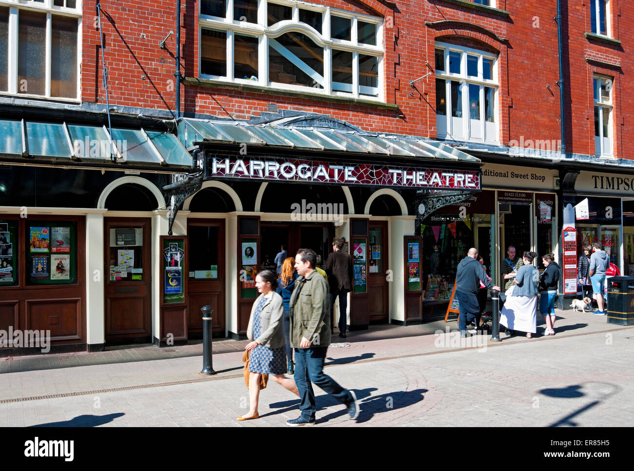 People walking by Harrogate Theatre exterior Oxford Street Harrogate ...