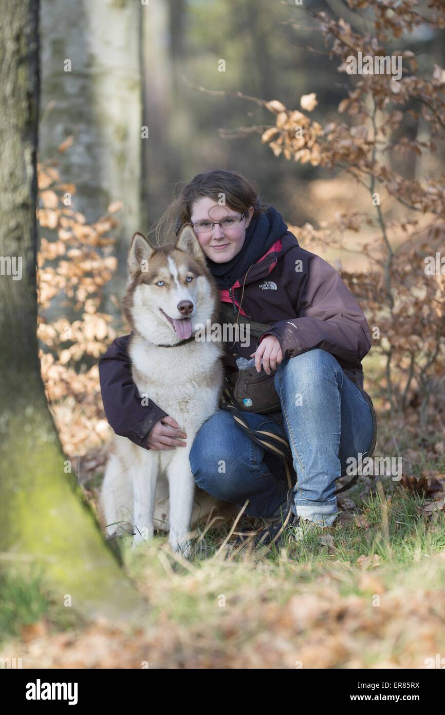 Woman hugs husky breed dog hi-res stock photography and images - Alamy