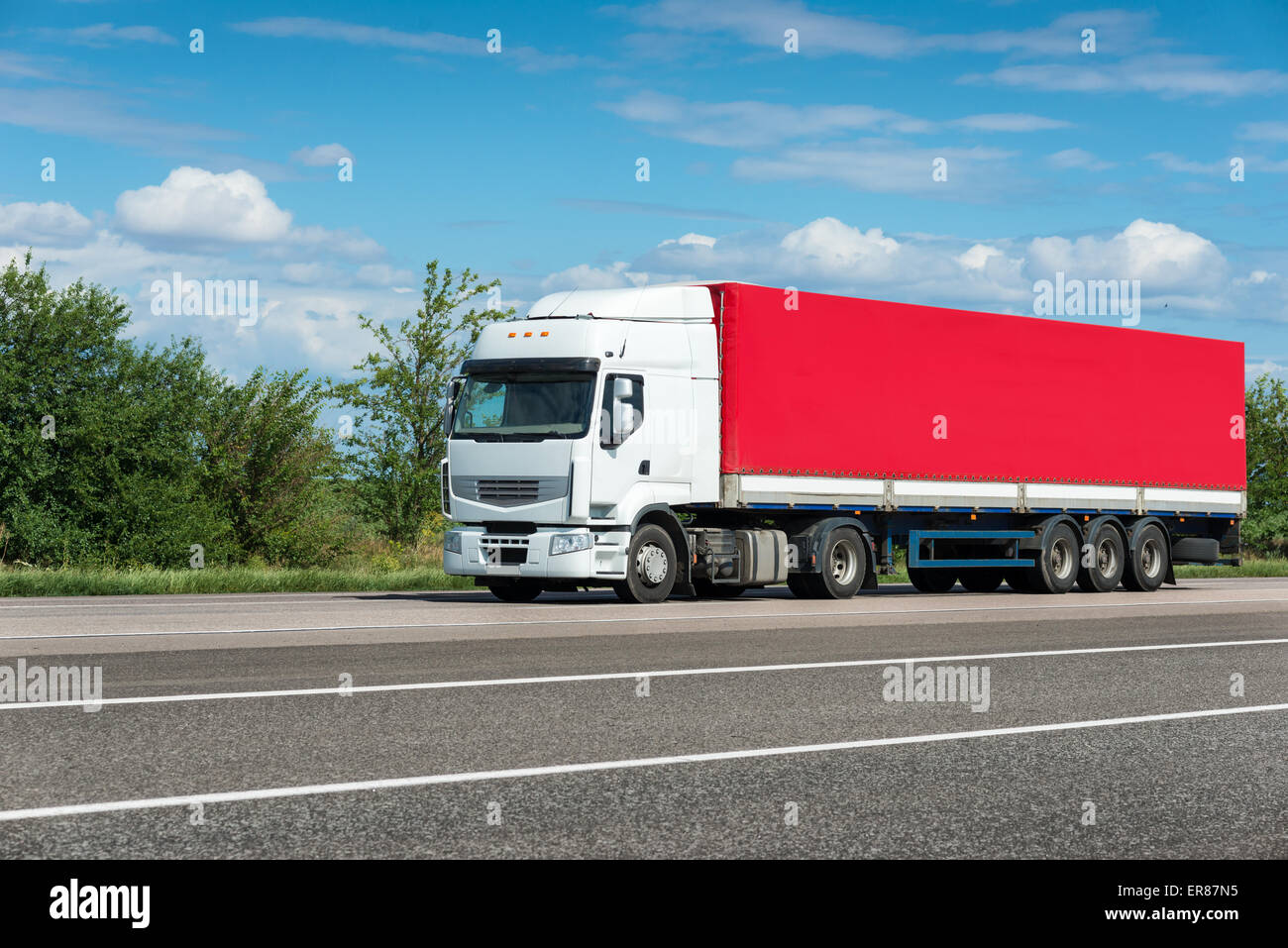 red truck on road. cargo transportation Stock Photo - Alamy