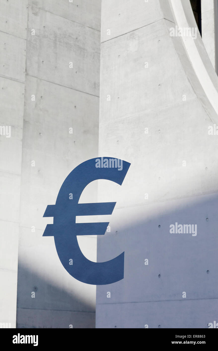 Euro symbol against concrete wall Stock Photo - Alamy