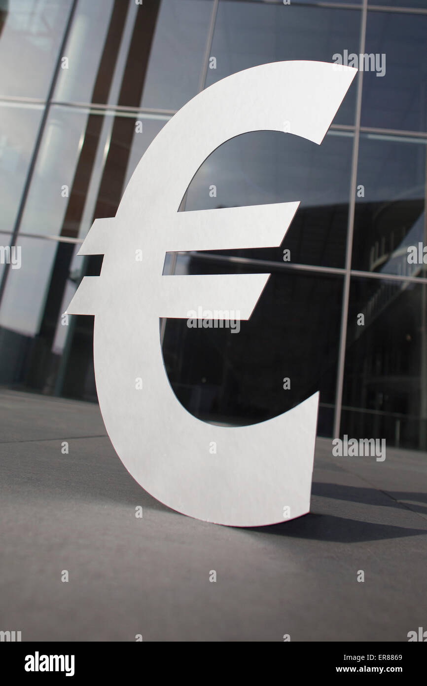 Euro symbol outside office building Stock Photo - Alamy