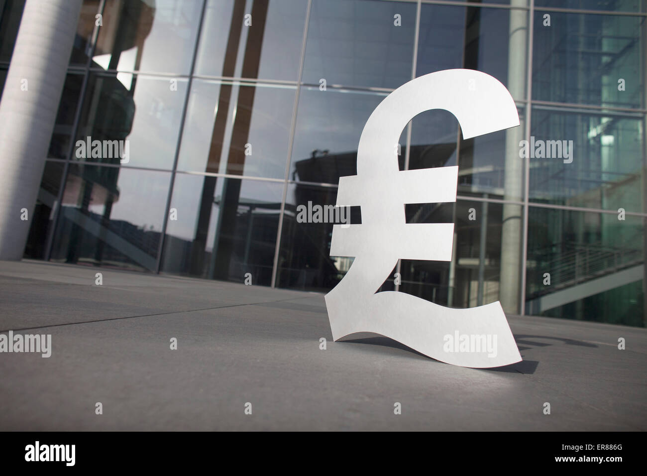 Pound symbol outside office building Stock Photo - Alamy