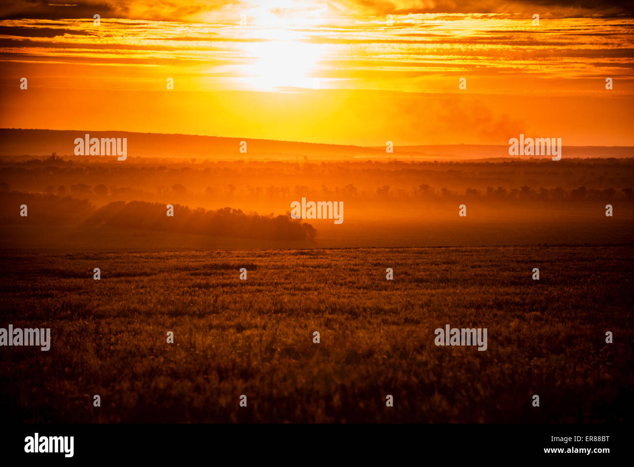 bright sunset landscape as background Stock Photo - Alamy