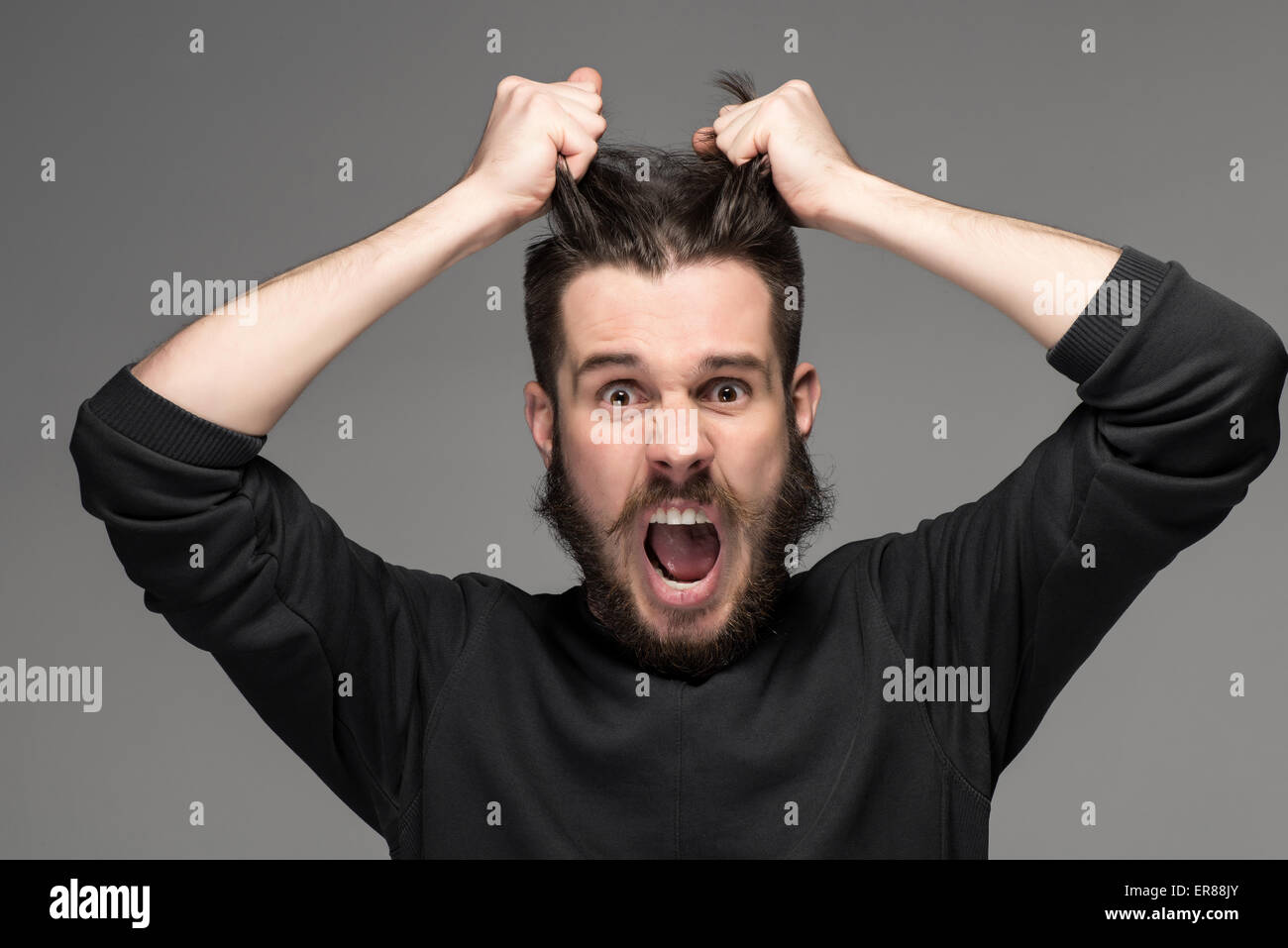 frustration, man tearing hair out in anger Stock Photo - Alamy