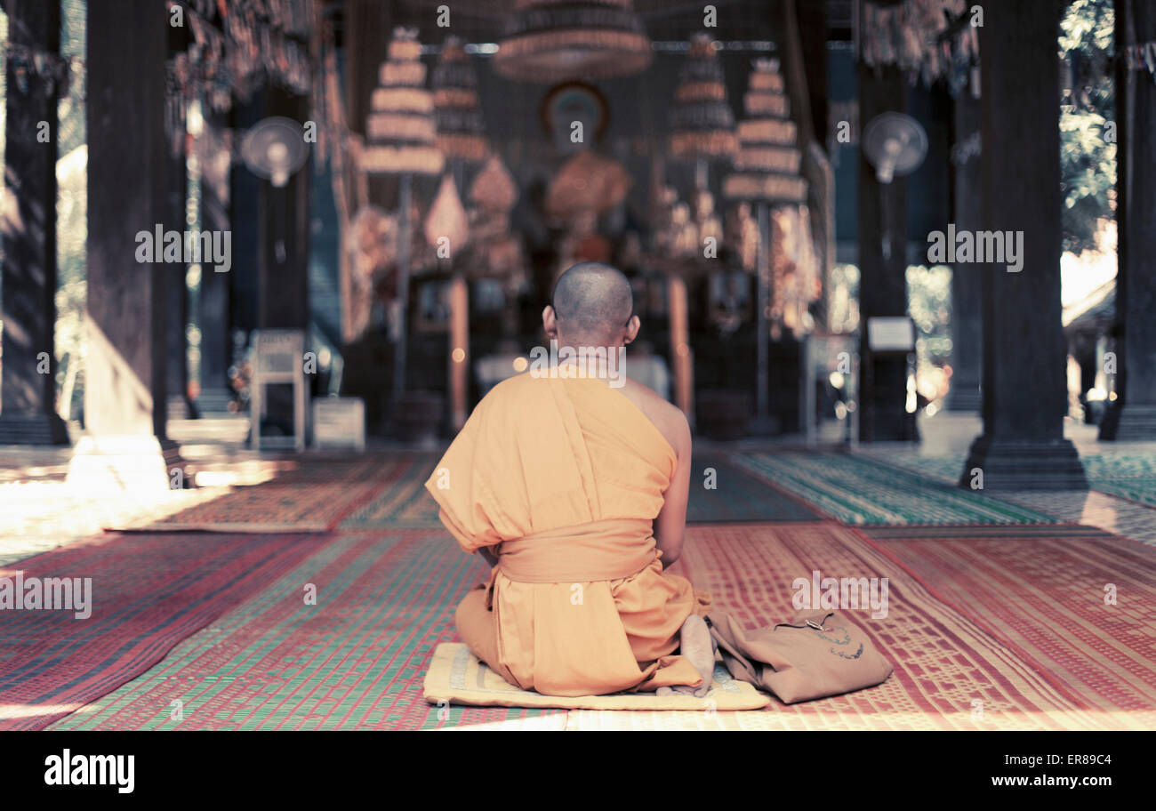 Rear view of monk sitting at Angkor Wat, Cambodia Stock Photo - Alamy