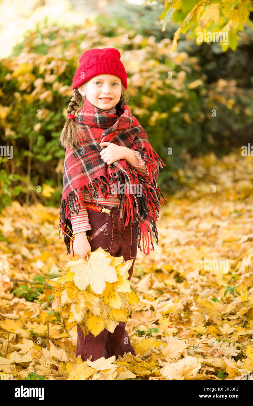 little girl in autumn park Stock Photo - Alamy
