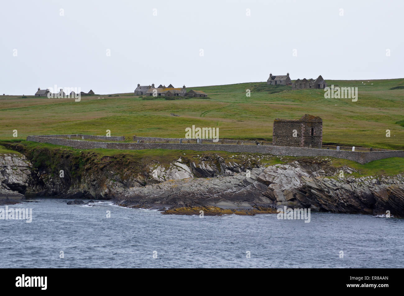 Derelict church and abandoned farm buildings on Stroma island ...