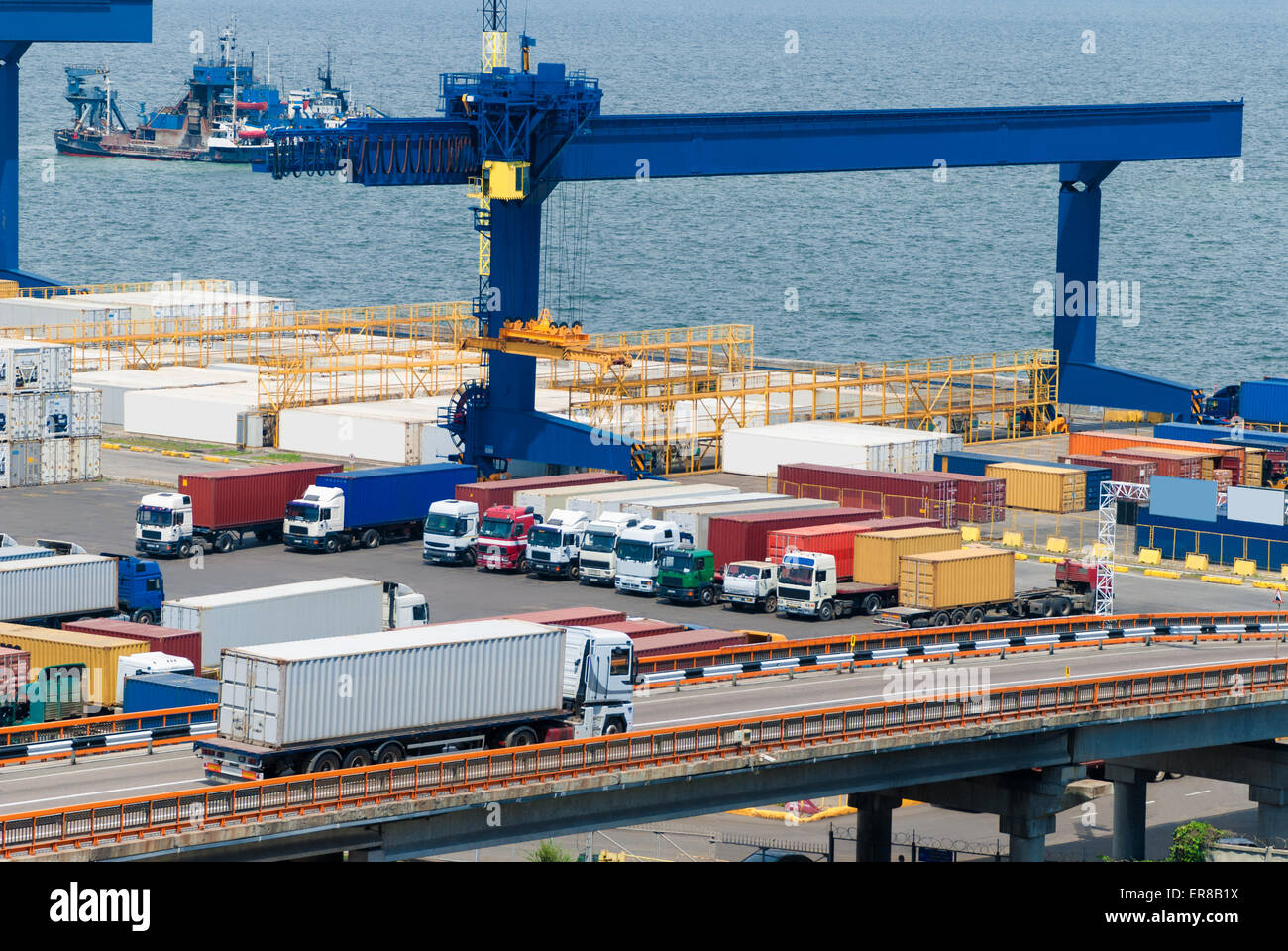 truck carries container to warehouse near sea Stock Photo - Alamy