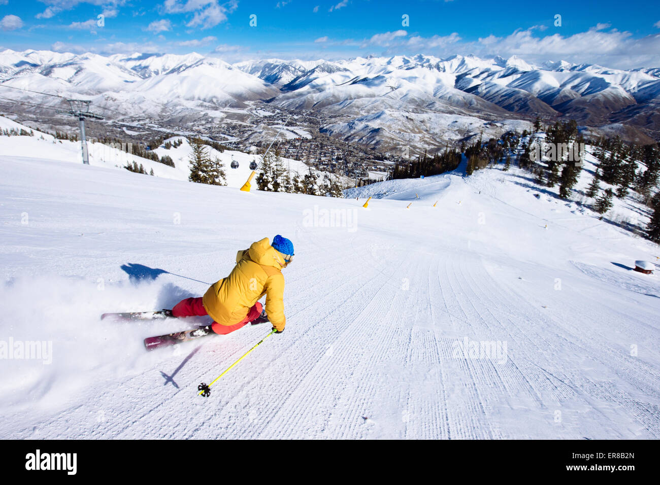 A woman skiing fresh groomers Stock Photo - Alamy