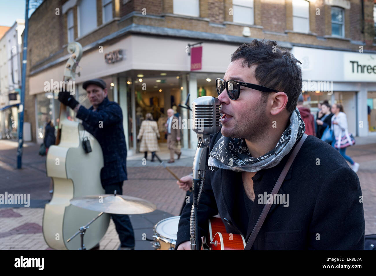 Buskers singing and playing musical instruments, KIngston upon Thames ...