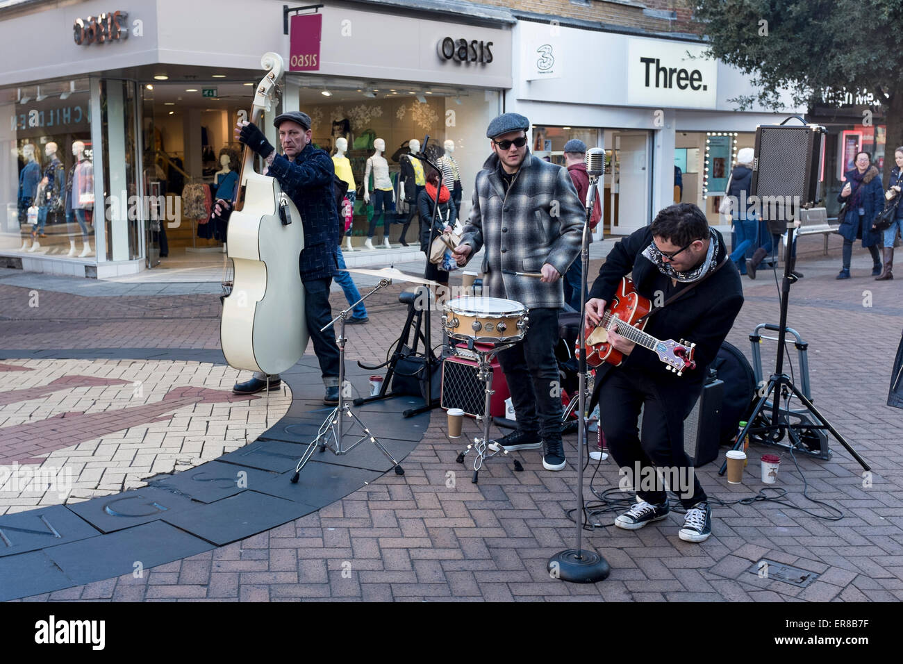 Buskers singing and playing musical instruments, Kingston upon Thames ...