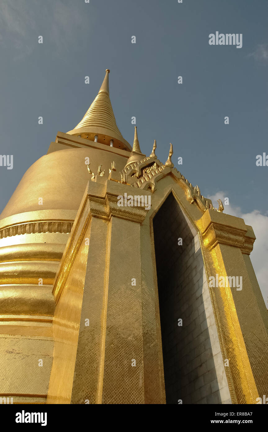 Golden stupa gate and blue sky in Bangkok Thailand Stock Photo - Alamy