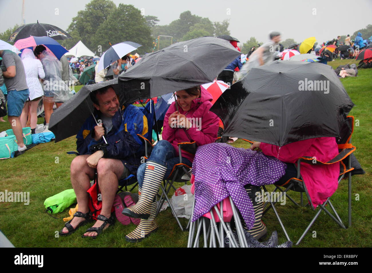 Festival goers shelter during high winds and heavy rain at Spelndour ...