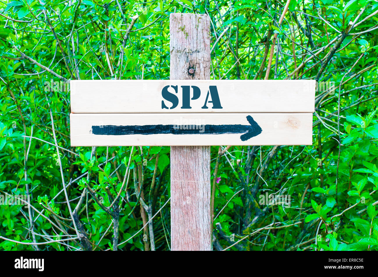 SPA written on Directional wooden sign with arrow pointing to the right ...