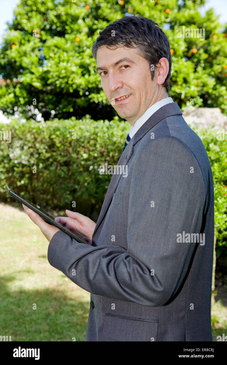 Focused businessman holding digital hi-res stock photography and images ...