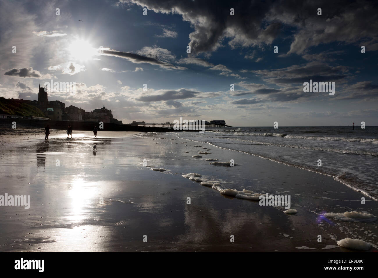 Walk on beach sunset walkers Stock Photo - Alamy