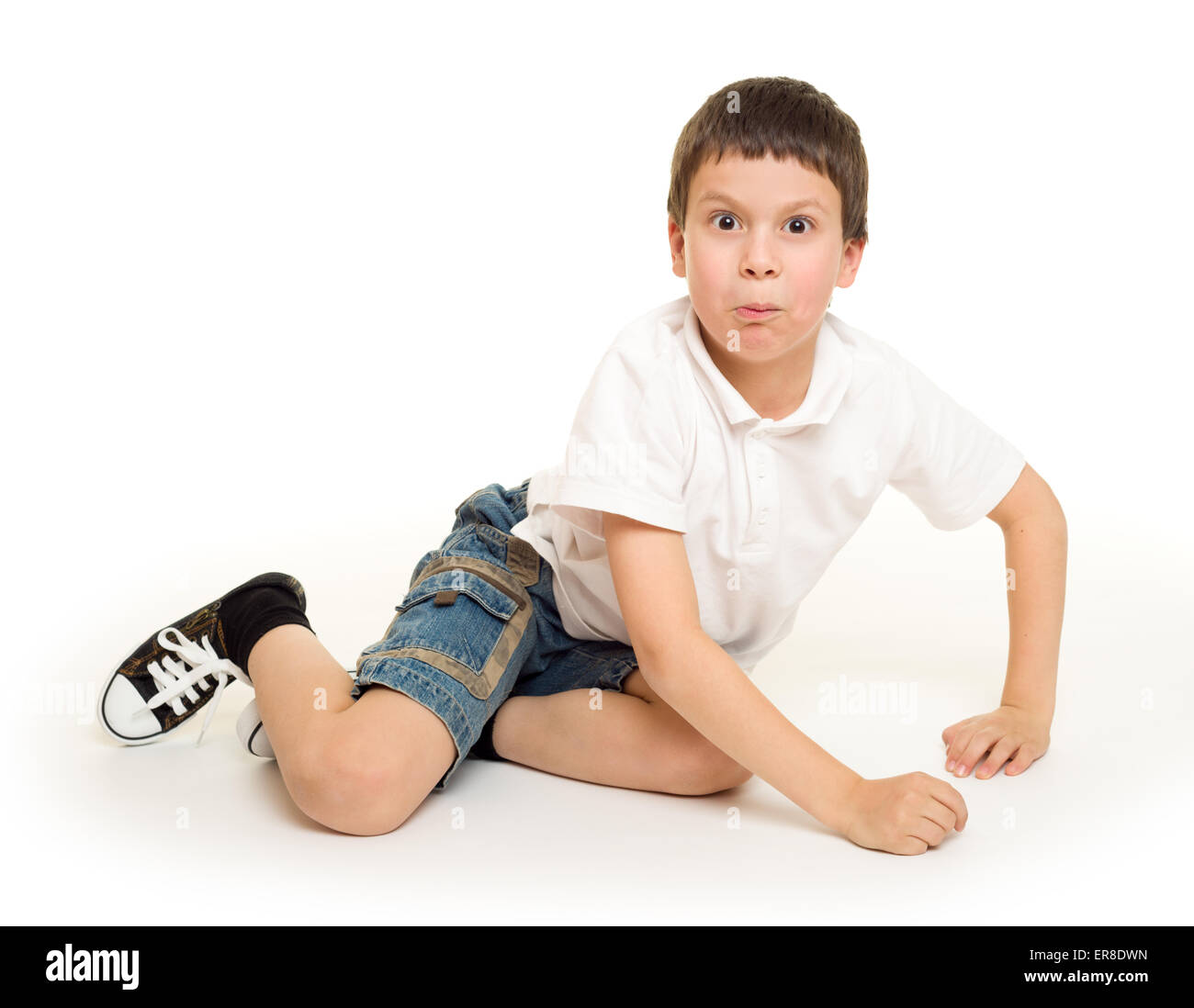 boy lie on white studio isolated Stock Photo - Alamy
