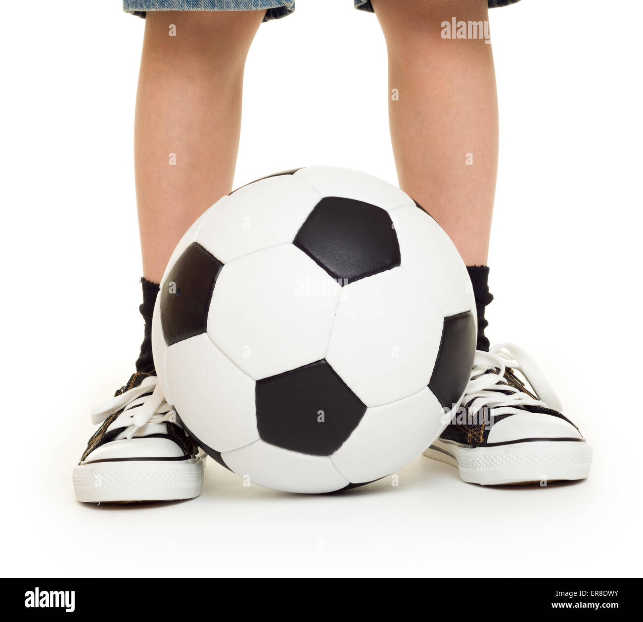 feet shod in sneakers and soccer ball studio isolated Stock Photo - Alamy