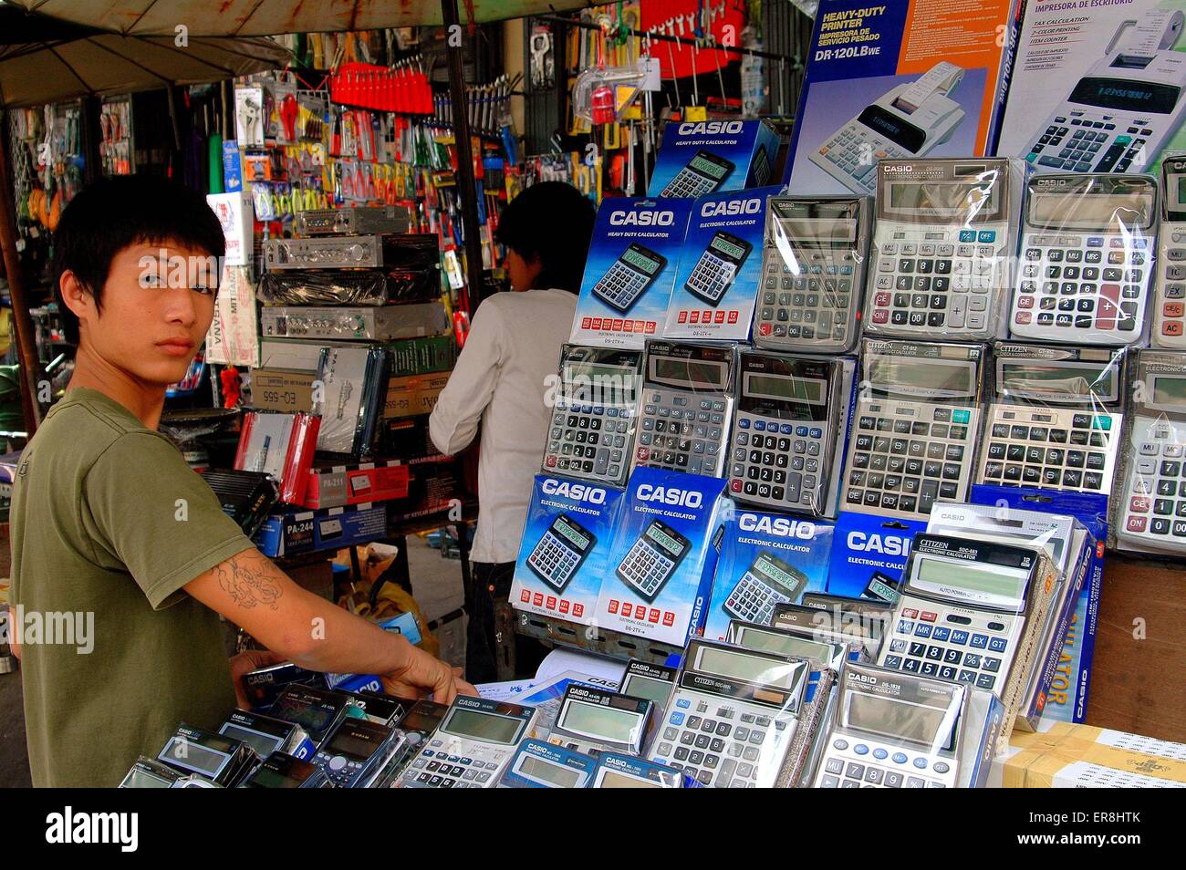 Bangkok, Thailand: Thai youth selling Casio adding machines at an ...