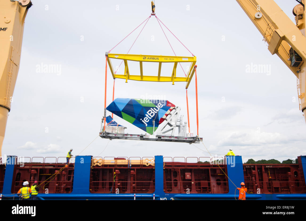 Hamburg, Germany. 29th May, 2015. Employees load the rear wing of an ...