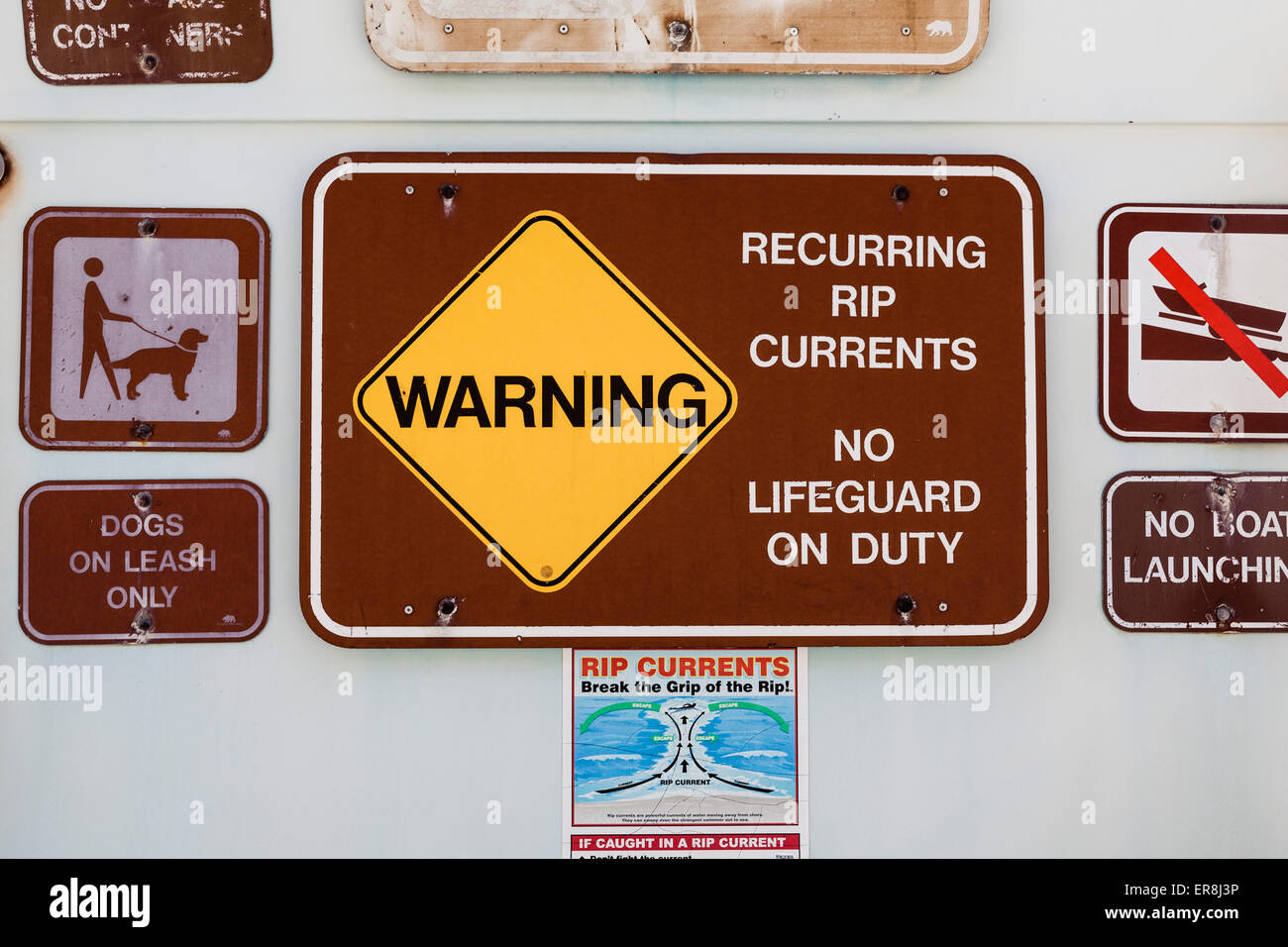 Warning signs on wall Stock Photo - Alamy