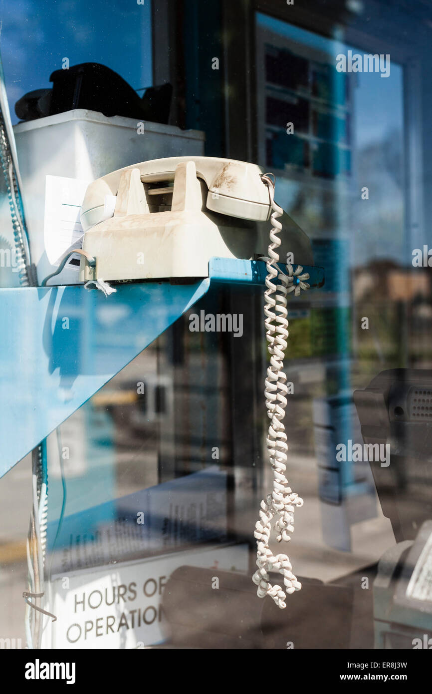 Old-fashioned telephone by glass wall Stock Photo - Alamy