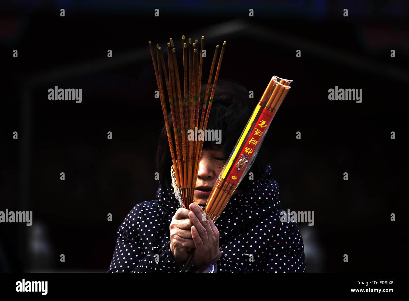 Feb 19, 2015-Huaibei, China- Chinese worshippers pray at a temple in ...