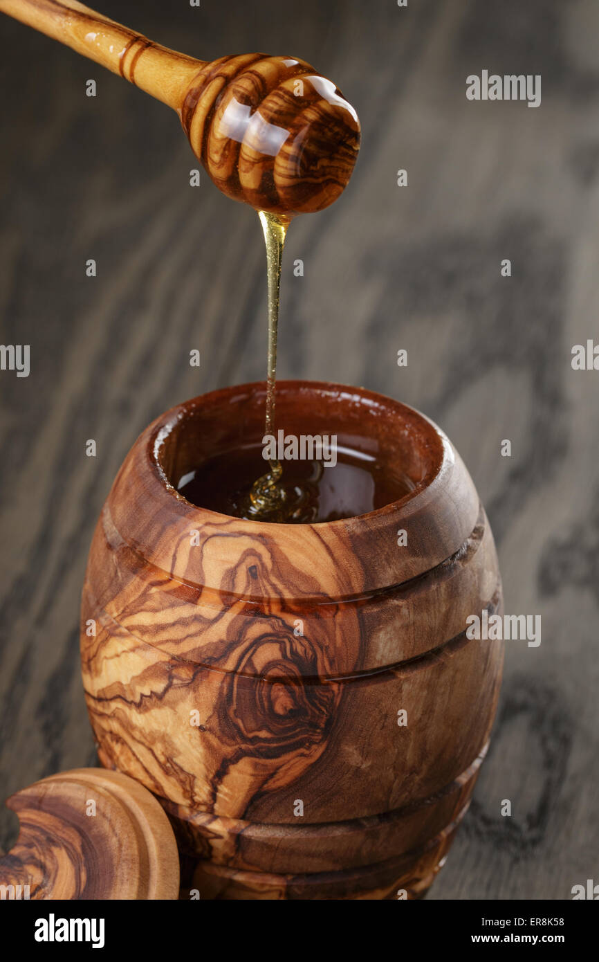 maple honey flowing from dipper to pot, rustic Stock Photo - Alamy