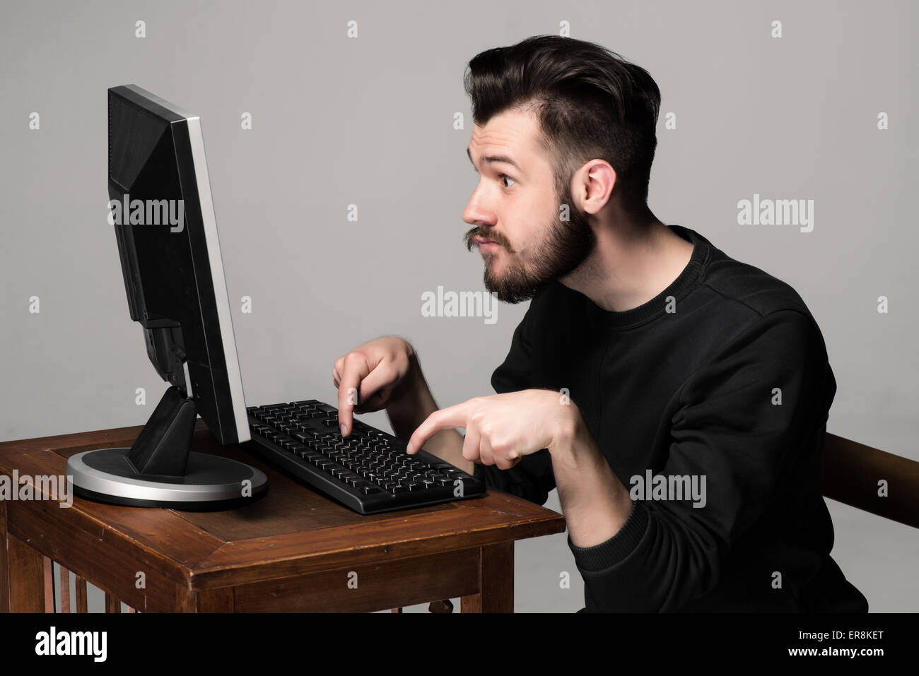 Funny and crazy man using a computer Stock Photo - Alamy