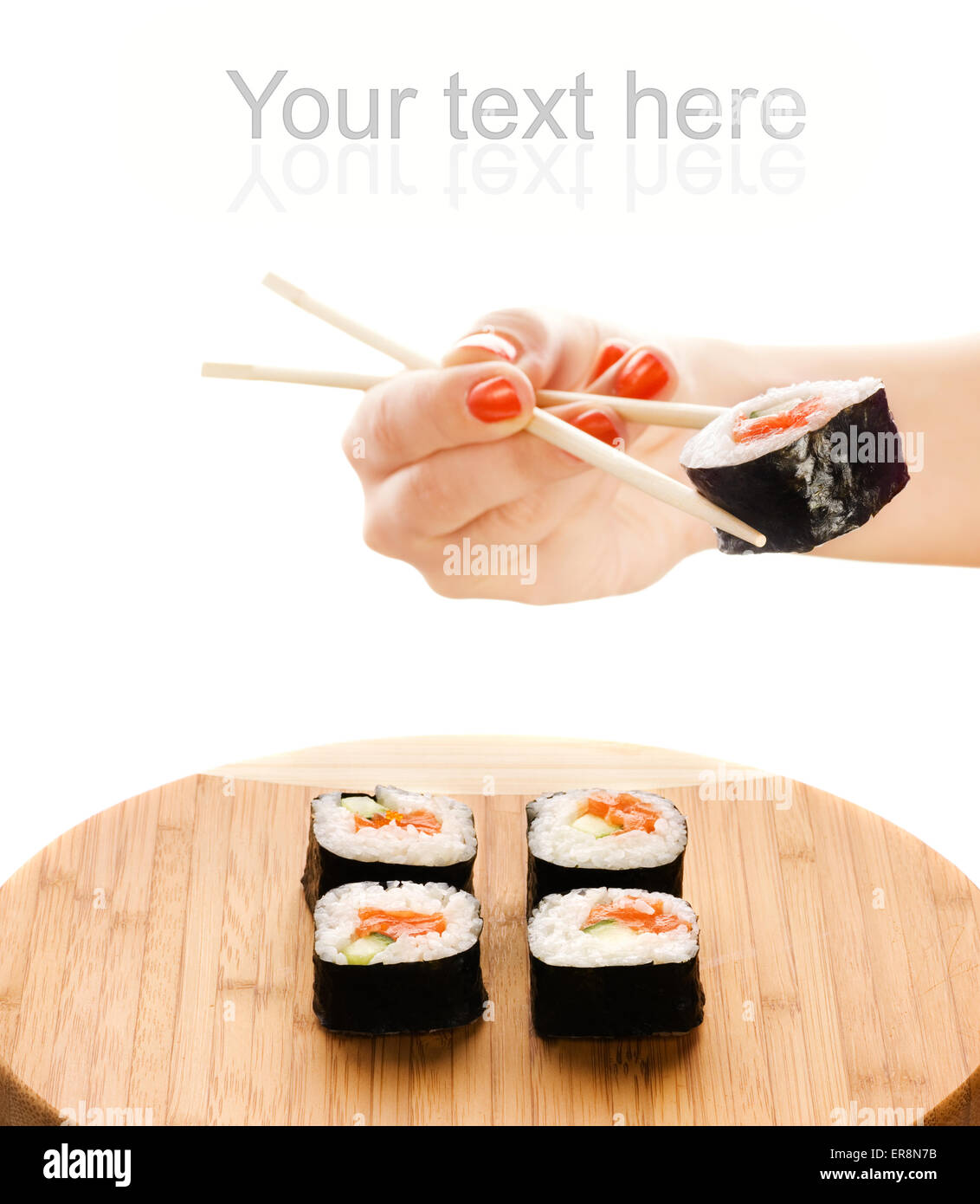 Hand holding sushi maki with wooden chopsticks Stock Photo - Alamy