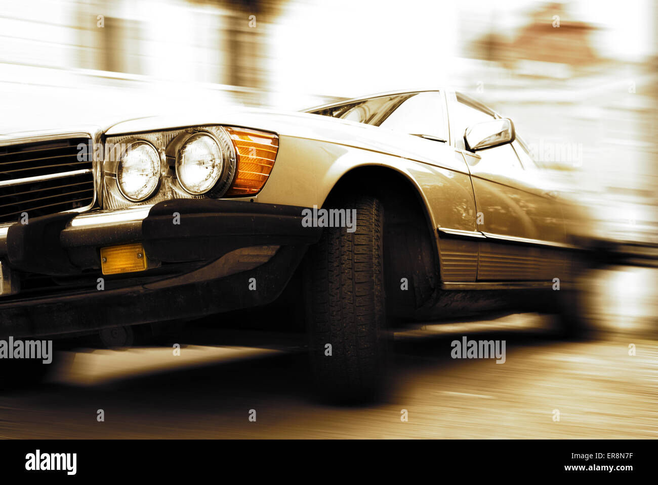 Old car driving fast Stock Photo - Alamy