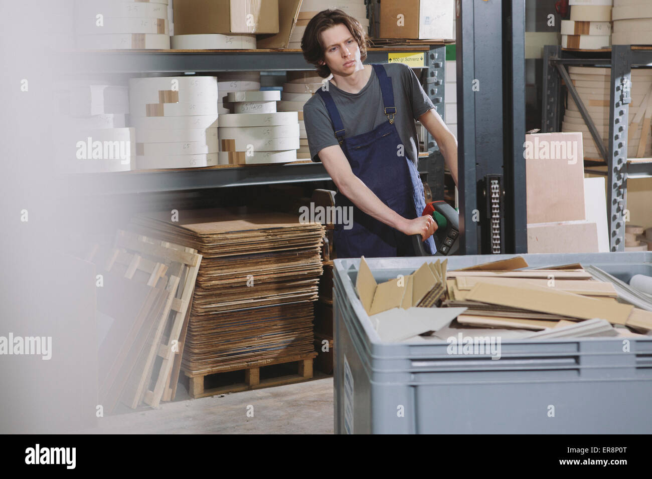 Worker operating forklift in warehouse hi-res stock photography and ...
