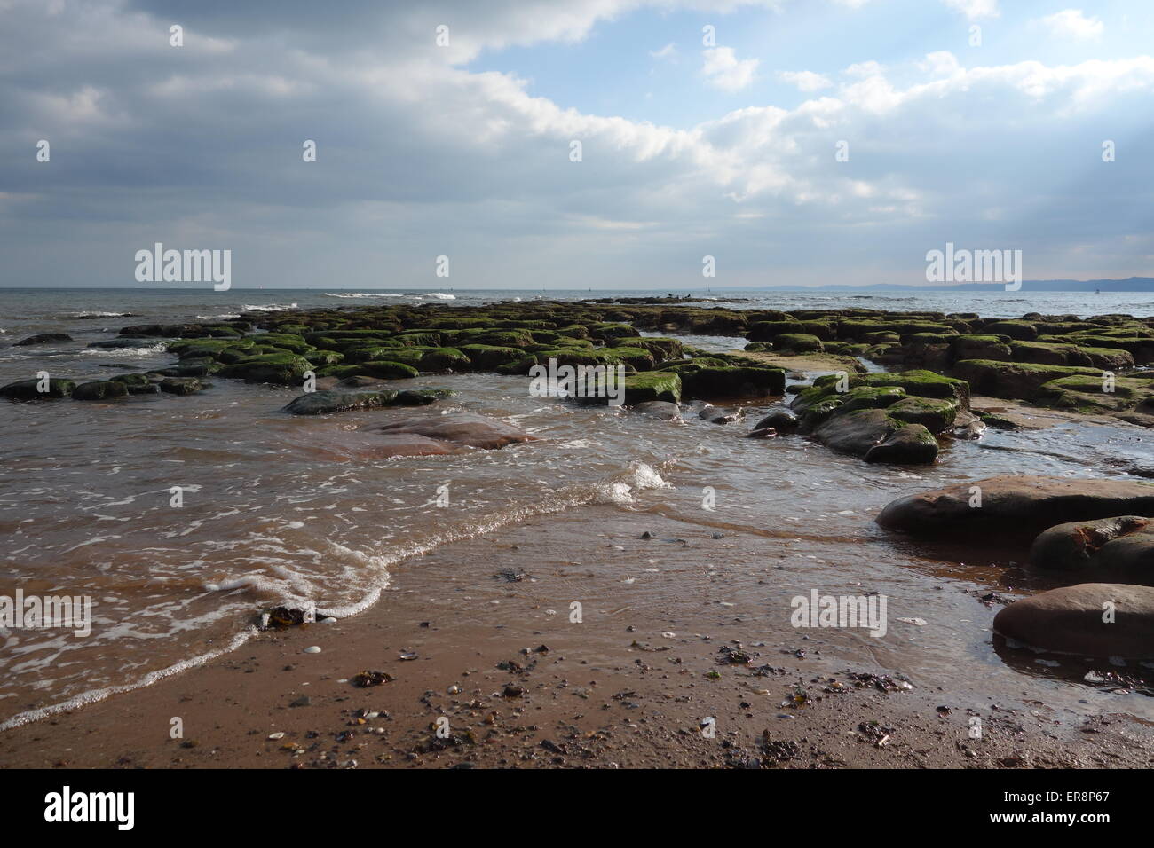 Tide covering Rock Pools Stock Photo - Alamy
