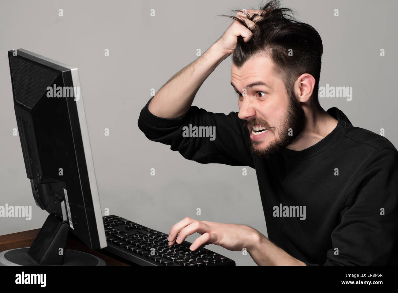 Funny and crazy man using a computer Stock Photo - Alamy