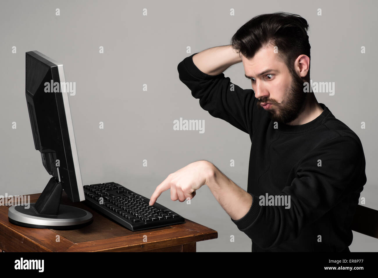 Funny and crazy man using a computer Stock Photo - Alamy