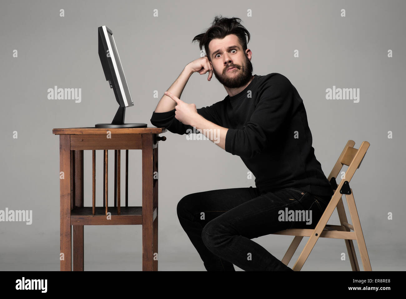 Funny and crazy man using a computer Stock Photo - Alamy