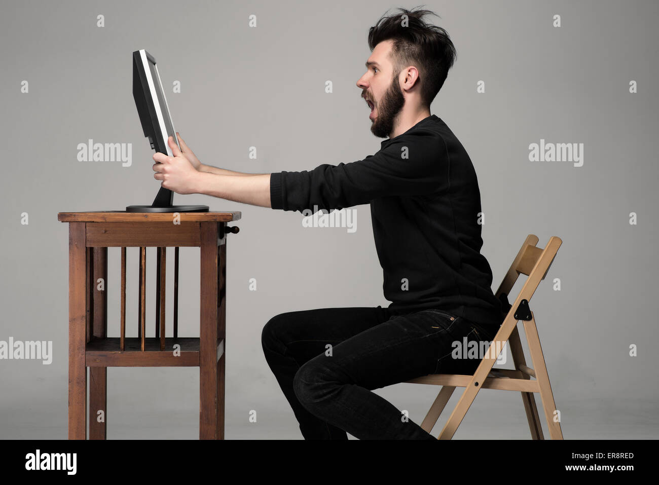 Funny and crazy man using a computer Stock Photo - Alamy