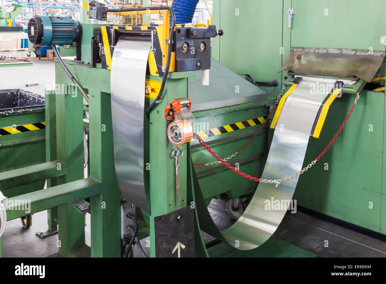 aluminum ribbon that goes to feed a press Stock Photo - Alamy