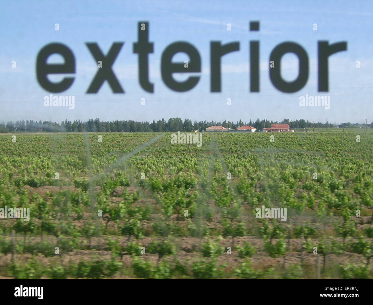 Agricultural field seen through glass window with text Stock Photo - Alamy