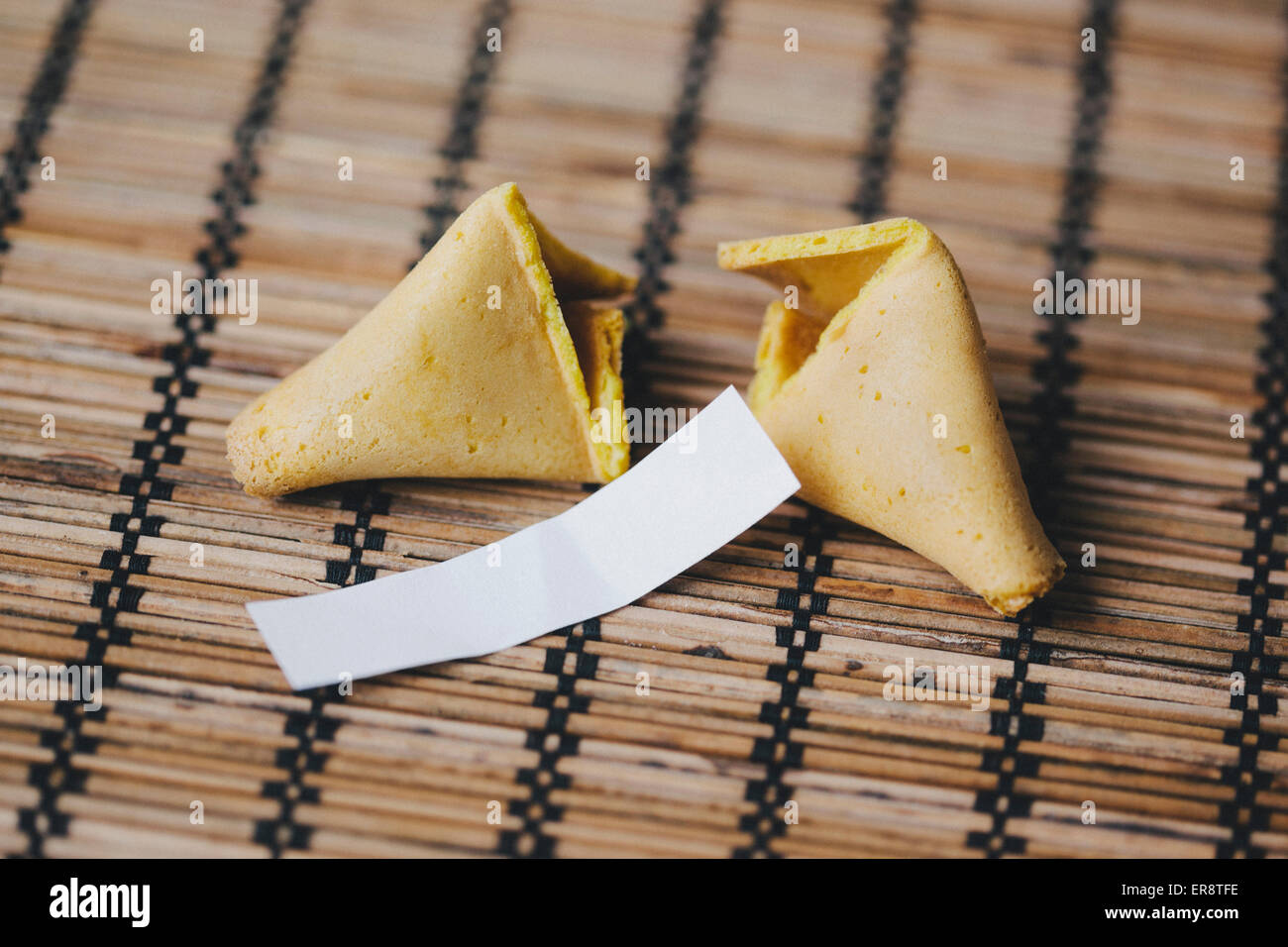 Broken fortune cookie on bamboo mat Stock Photo - Alamy Broken fortune cookie on bamboo mat Stock Photo - Alamy