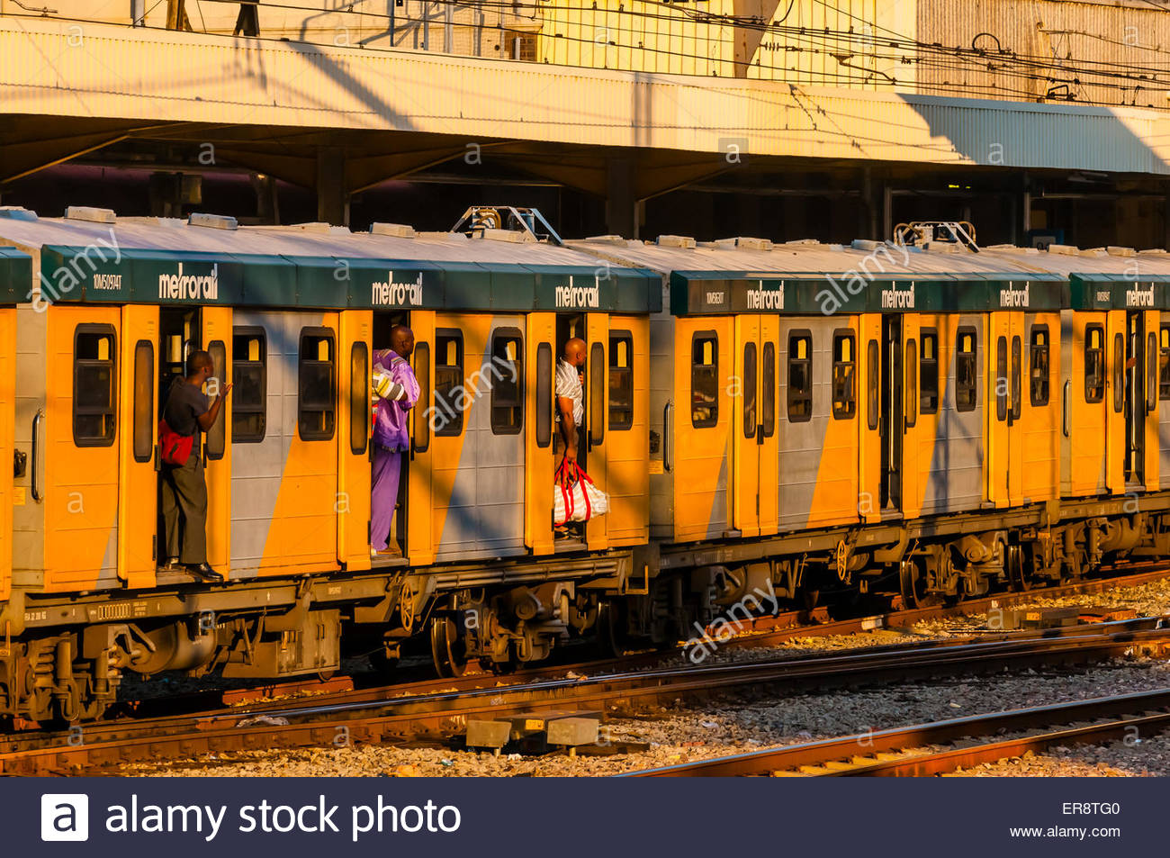 Commuters riding Metrorail train between Pretoria and Johannesburg ...