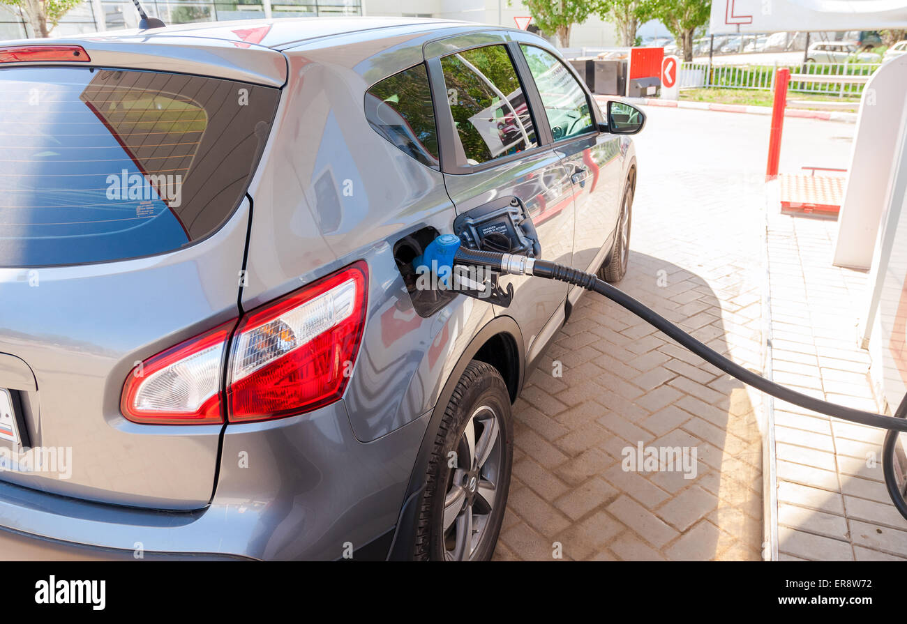 Passenger car fueled with petrol at a petrol station Stock Photo - Alamy