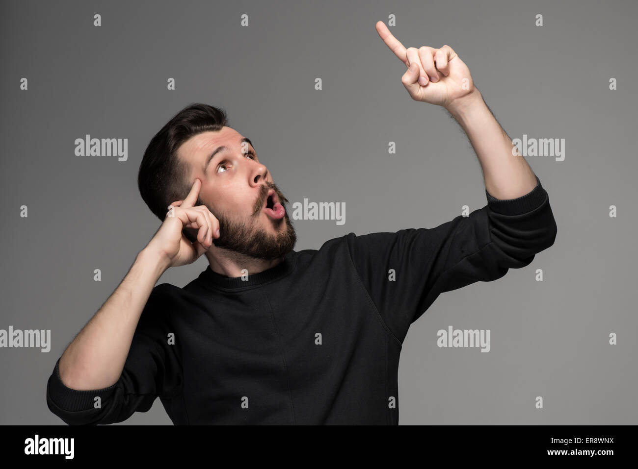 Eureka. man with an idea raising his finger in the air Stock Photo - Alamy