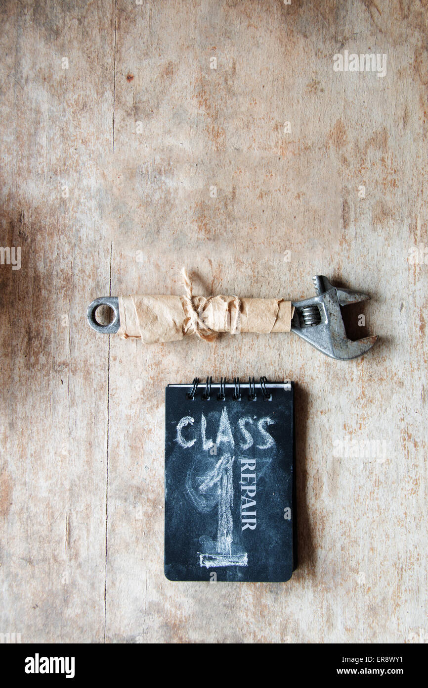 Repair concept. Inscription repair, first class and a wrench on a ...