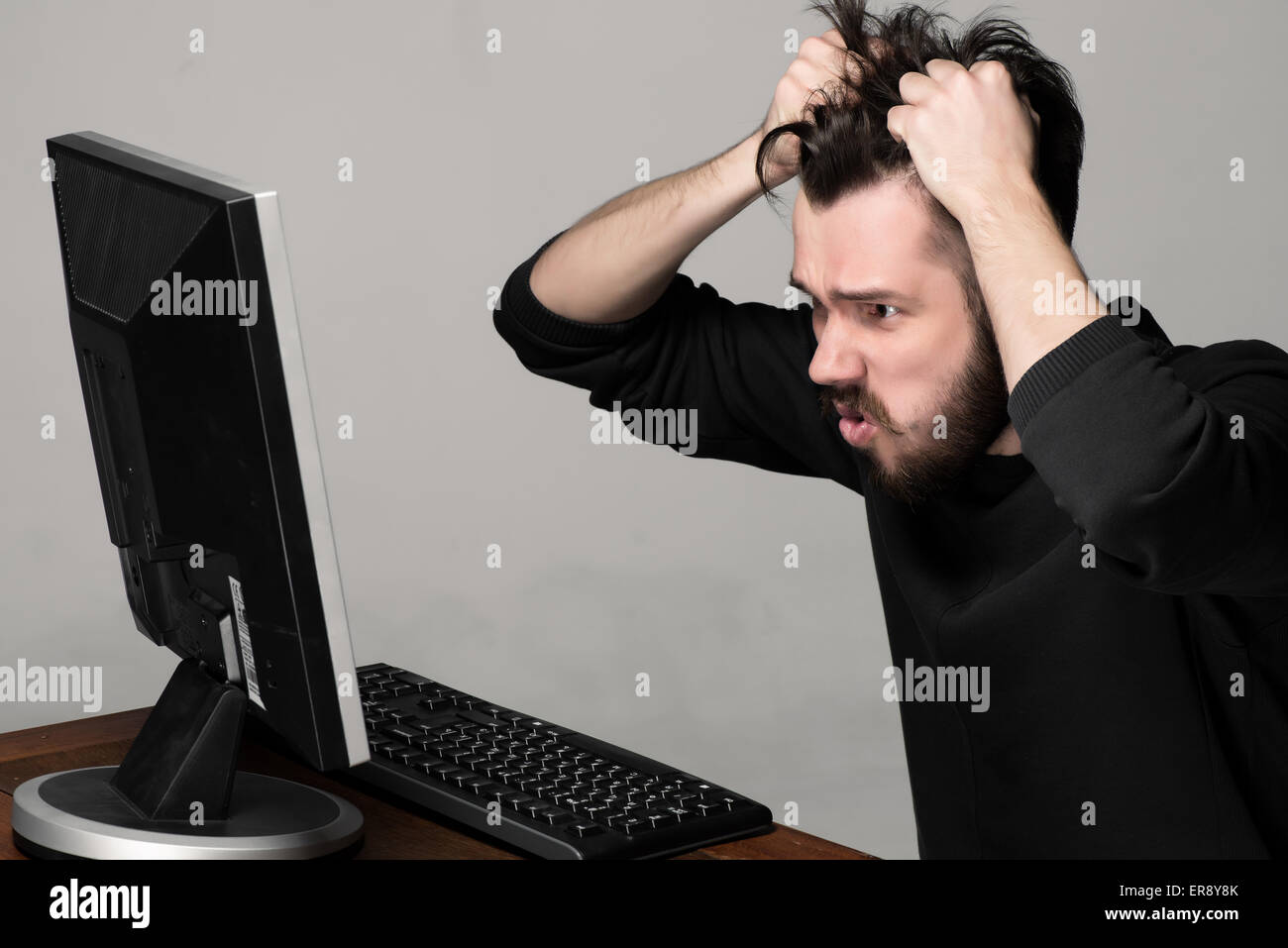Funny and crazy man using a computer Stock Photo - Alamy