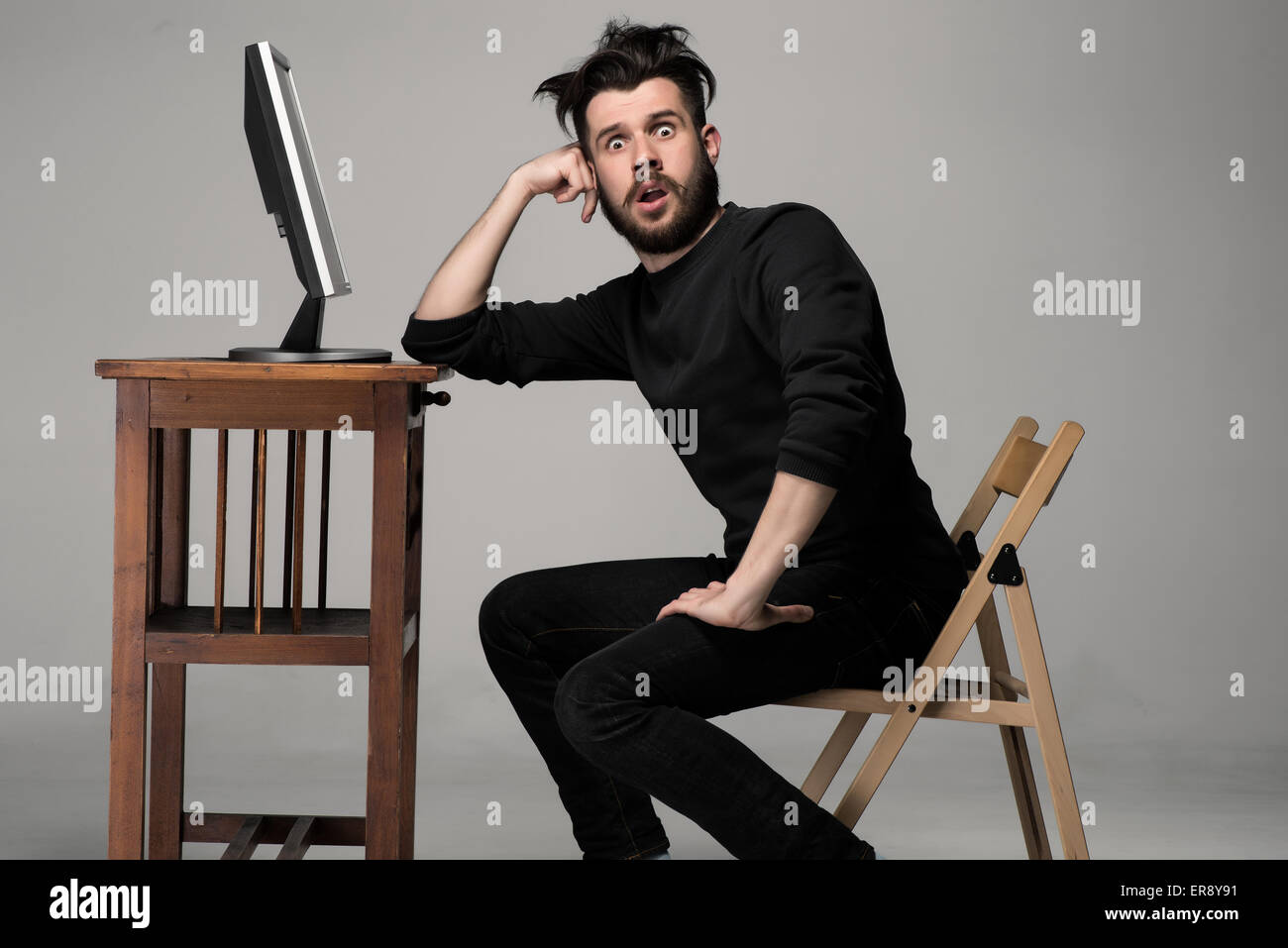 Funny and crazy man using a computer Stock Photo - Alamy