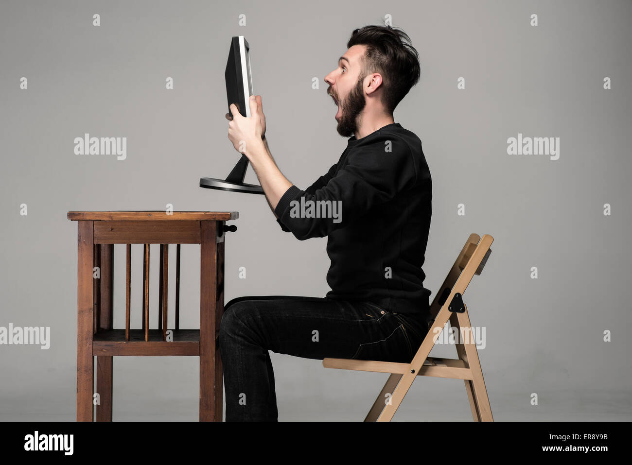 Funny and crazy man using a computer Stock Photo - Alamy